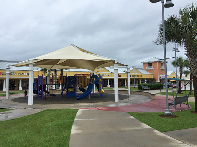 The covered playground offers a tactical bribery station for parents: "Just fifteen more minutes in one more store, and then you can slide."