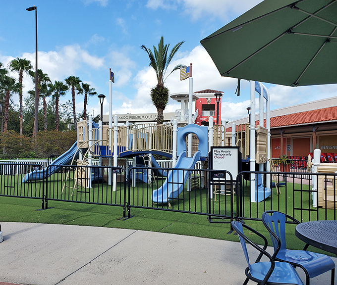 A thoughtful playground oasis where kids can burn energy while parents debate whether they really need another pair of discounted designer shoes.