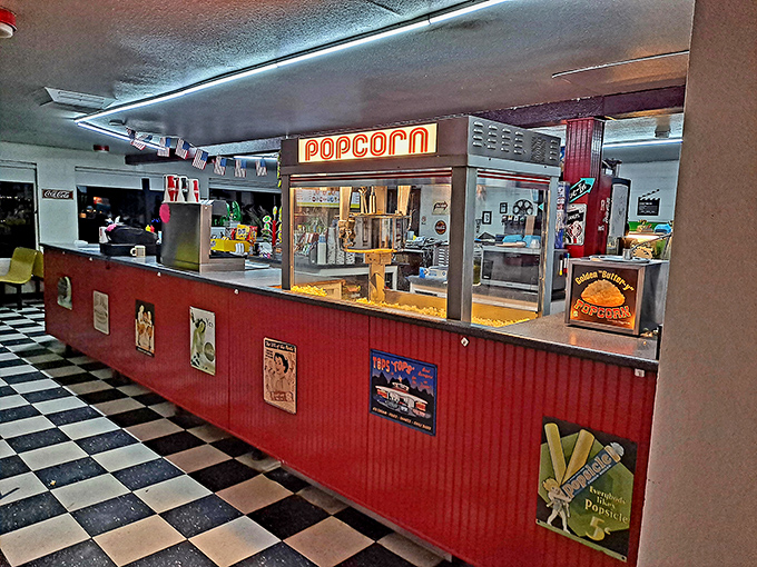 The popcorn counter, with its retro signage and classic design, promises the unmistakable aroma of movie night bliss.