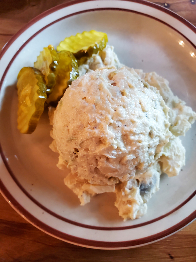 Potato salad that doesn't try to reinvent the wheel—just perfect it with the creamy, comforting consistency of a Southern hug.