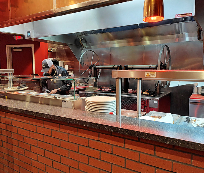 That open kitchen with its gleaming grill is where the magic happens, turning quality beef into memorable meals nightly.