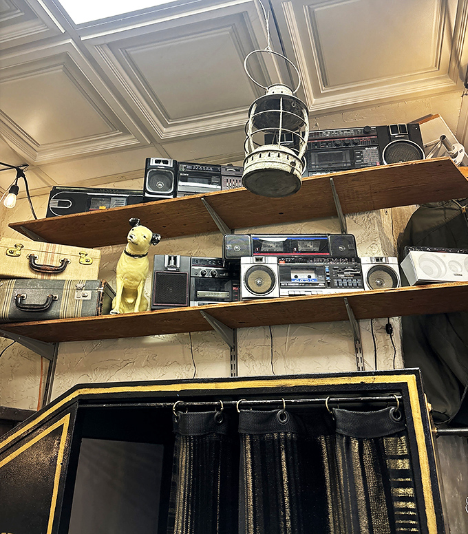 Vintage boomboxes and radios line the shelves like a museum of how we once shared music before streaming existed.