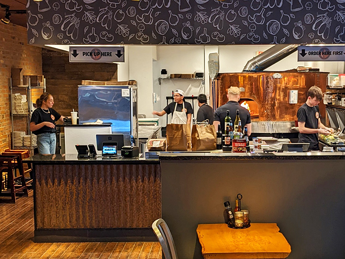 The ordering counter &ndash; where dreams are placed and pizza promises are made with a smile.