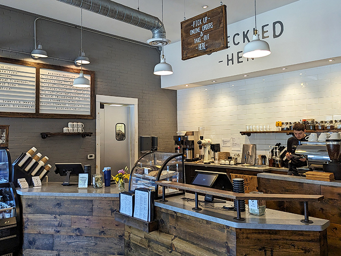 Where coffee dreams begin their journey to reality. This rustic wooden counter has witnessed countless caffeine emergencies successfully resolved.