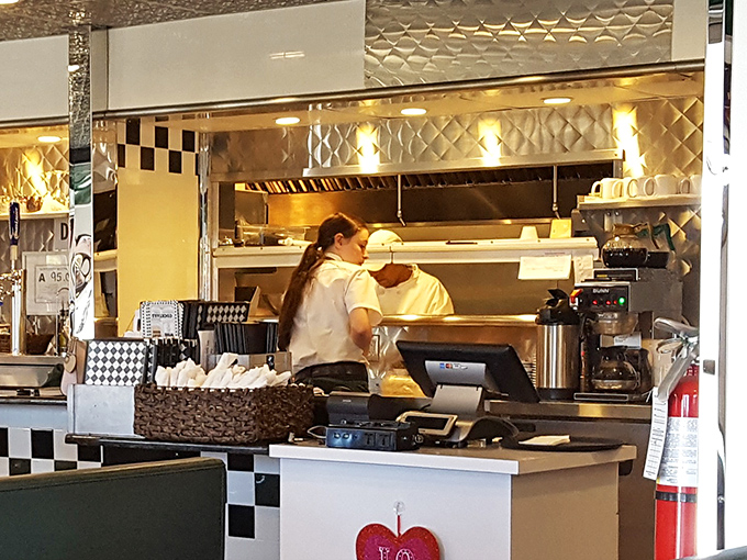 Behind the scenes glimpse: Where burger dreams become reality, as staff orchestrates the delicious dance that keeps hungry patrons coming back.