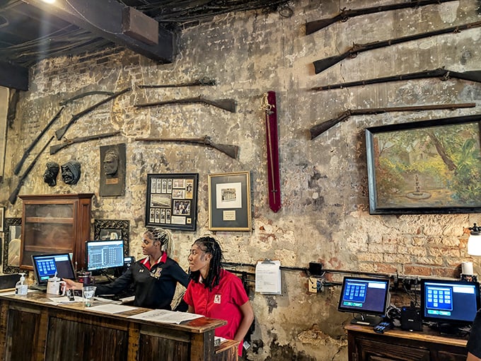 Behind this historic reception desk, generations of hosts have welcomed hungry visitors to one of New Orleans' most storied dining experiences.
