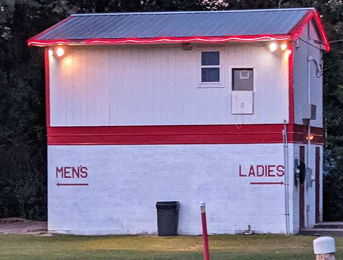 Even the restroom building embraces the vintage aesthetic, with its straightforward signage and no-nonsense design from a simpler era.
