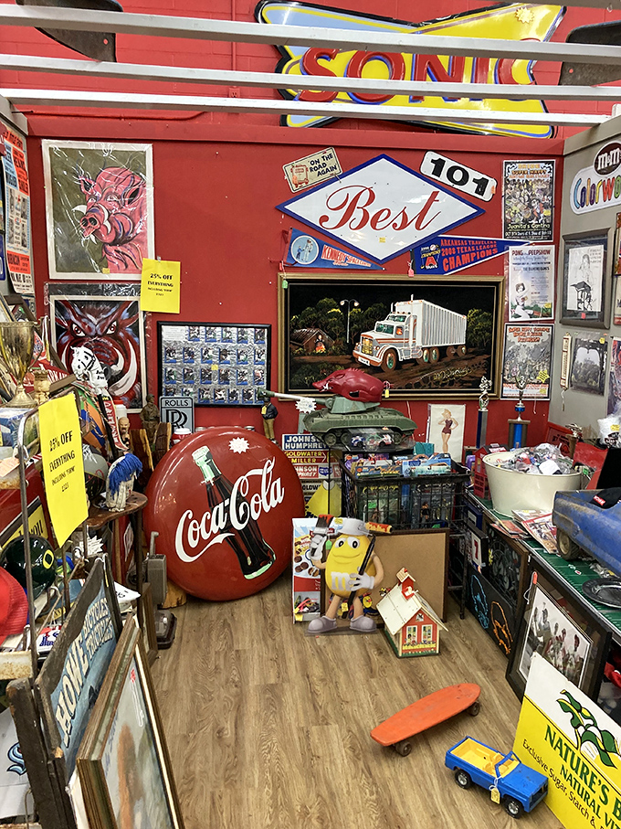 A Coca-Cola collector's dream corner, complete with vintage signs and that yellow M&M character who's seen better days.
