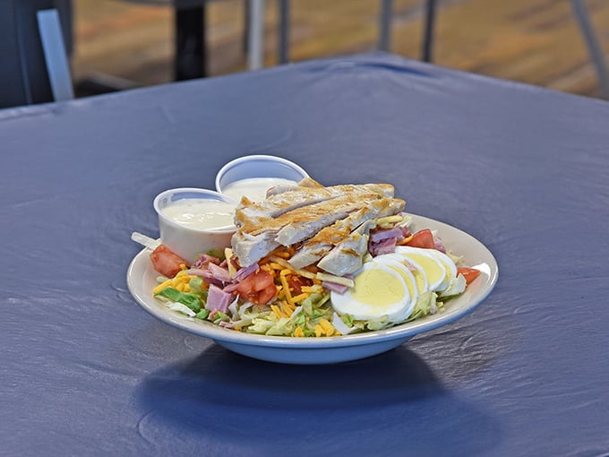 Fresh salad with crispy chicken strips offers a lighter option, though "lighter" is relative at a barbecue joint.