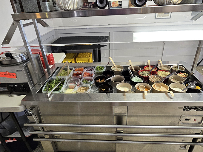 The salad bar stands ready, offering redemption for all the delicious damage you're about to do.