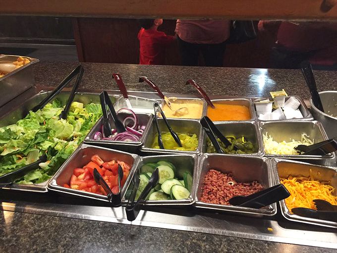 The salad bar offers colorful respite between seafood courses—though we all know it's really just plate real estate management.