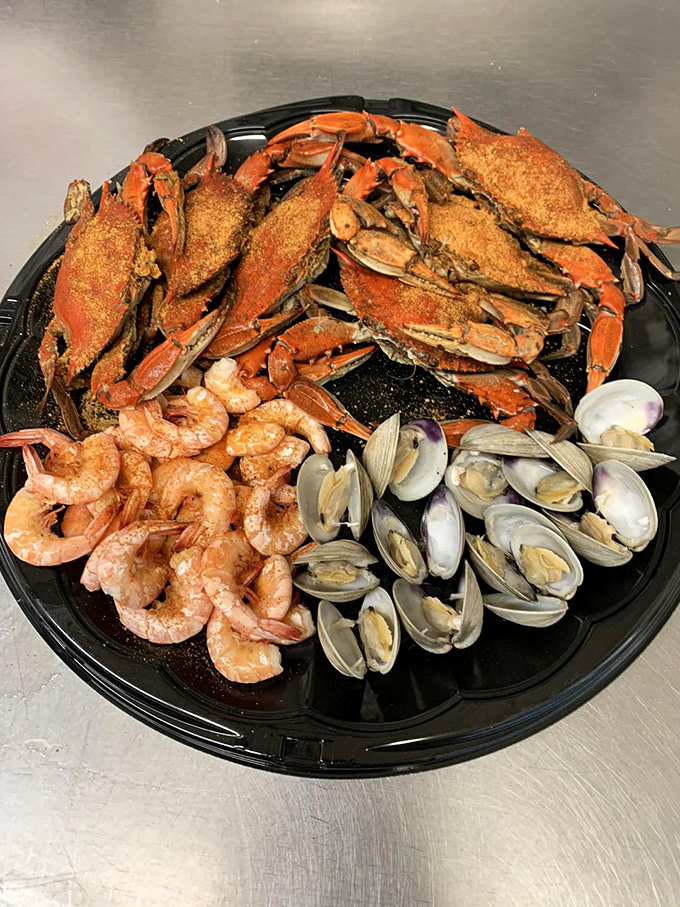 The seafood trifecta &ndash; crabs, shrimp, and clams sharing a plate like old friends at a reunion, each bringing their own special flavor.