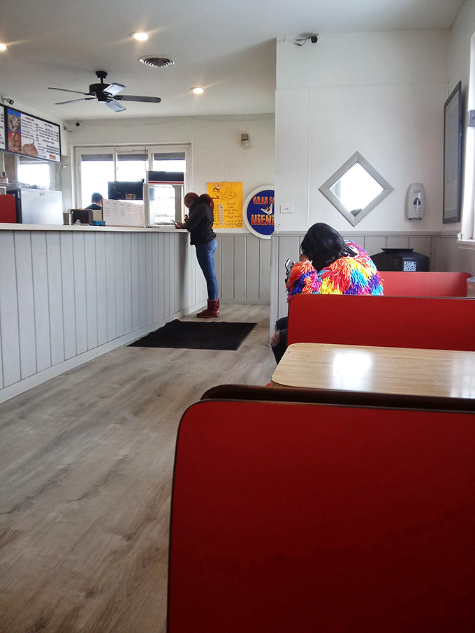 Simple red booths where culinary memories are made. No Edison bulbs or reclaimed wood – just comfortable seats for serious eating business.