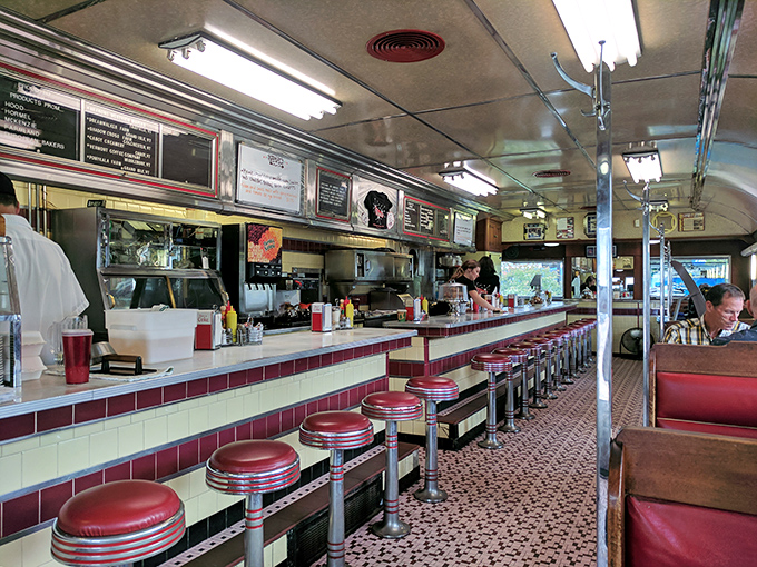 The diner's seating area offers that perfect blend of nostalgia and function&mdash;where "please wait to be seated" really means "prepare for happiness."