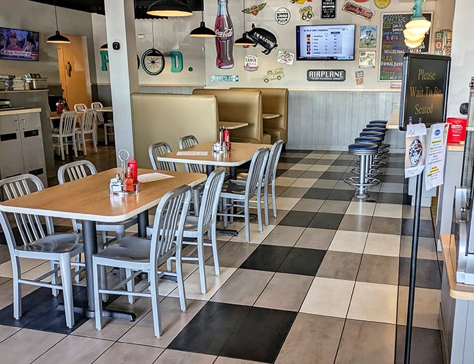 The checkered floor and retro furnishings create that perfect "been-here-forever" vibe that no designer could fake.