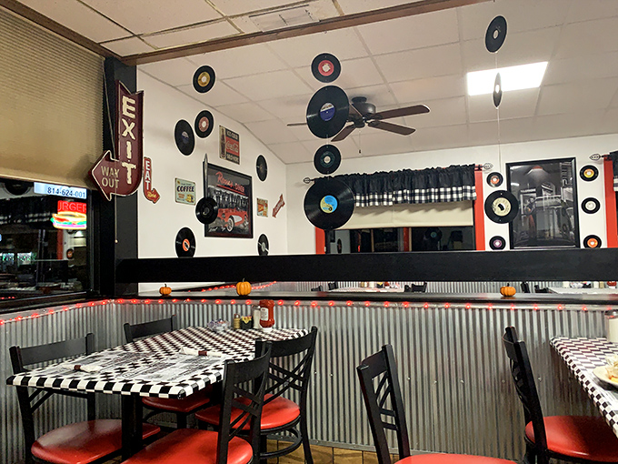 The dining area whispers stories of countless conversations, with vinyl records standing as silent witnesses to decades of shared meals.