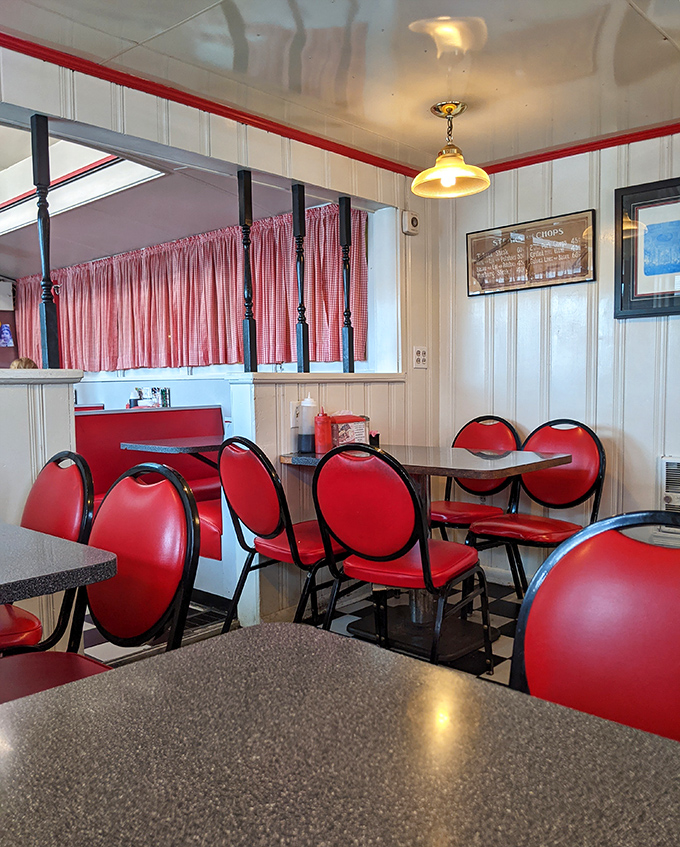 These red chairs aren't just seating&mdash;they're front-row tickets to the best breakfast show in Middletown, complete with checkered floor and nostalgic charm.