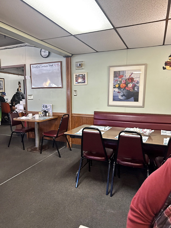 Simple tables set with placemats advertising local businesses – the quintessential small-town diner where function trumps fashion and nobody minds.