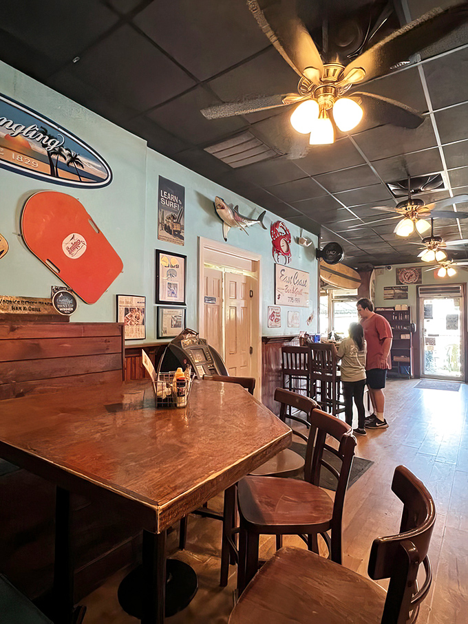 Surfboards and fishing memorabilia line the walls, reminding you that your dinner probably had a shorter commute than you did.