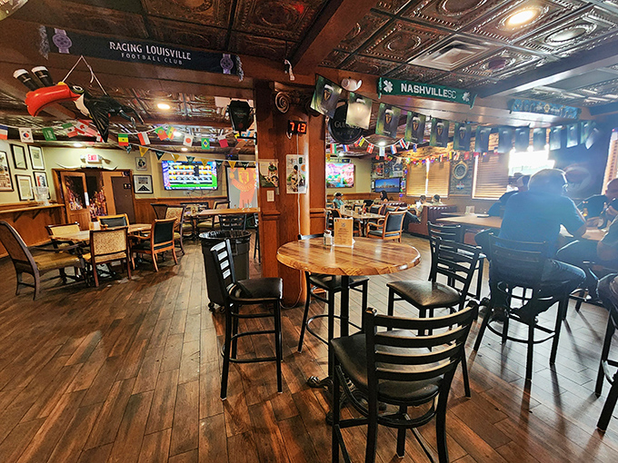 The warm wooden interior with strategically placed high-tops and tables creates conversation pockets perfect for both intimate chats and lively debates.