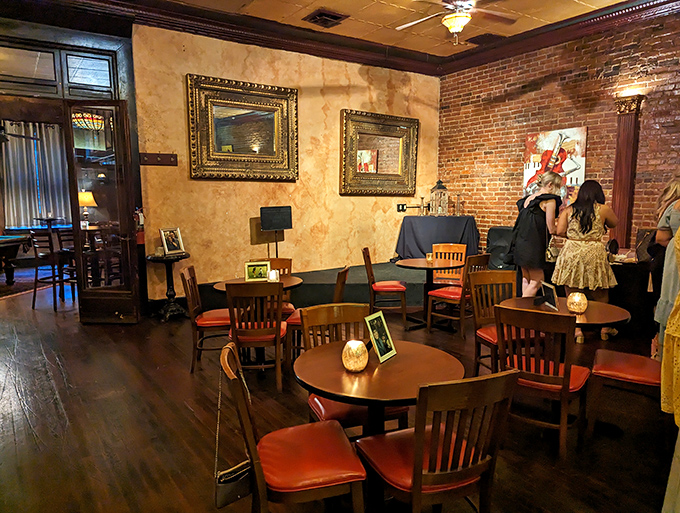 Textured walls meet rustic brick in this intimate corner of The Porterhouse, where every table feels like the best seat in the house for that life-changing ribeye experience.