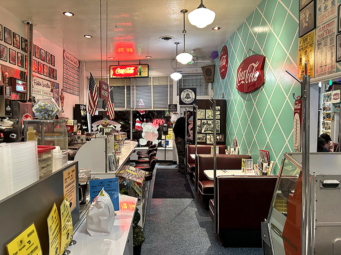 The mint-green diamond pattern meets Coca-Cola nostalgia in this perfectly preserved slice of diner architecture.