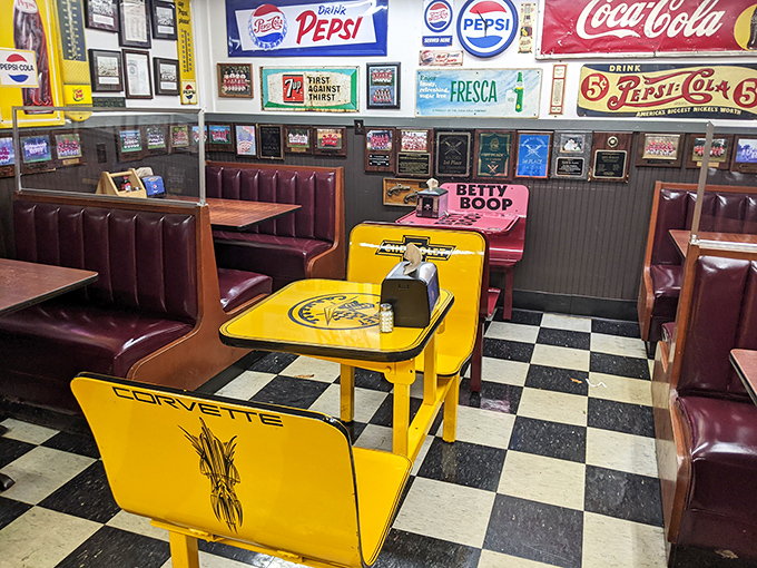 Betty Boop keeps watch over the yellow Corvette table—because why shouldn't breakfast have theatrical seating arrangements?