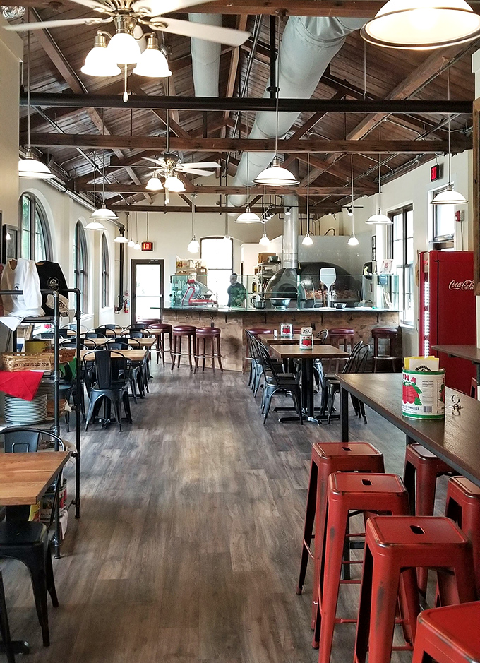 Industrial-chic meets cozy comfort in a dining room that invites you to linger long after the last slice disappears.