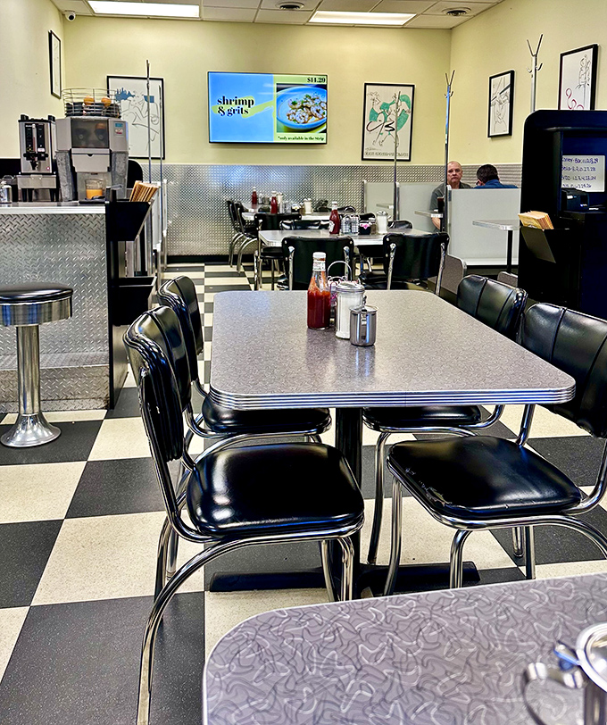 Retro tables and chairs await your breakfast decisions while the aroma of coffee and bacon makes choosing just one item nearly impossible.