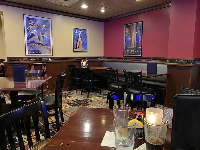 Art deco posters and warm wood tones create an atmosphere that says "special occasion" without whispering "check your bank account."