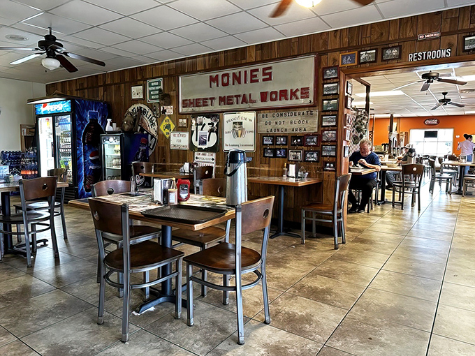 Monie's Sheet Metal Works sign watching over diners like a guardian angel of good eating.