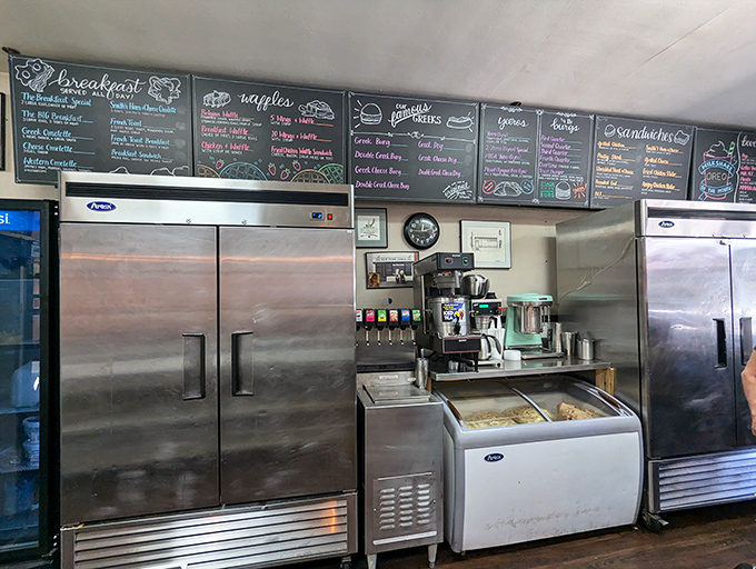 Behind the counter magic happens – where breakfast dreams come true on a grill that's been seasoned by decades of perfect pancakes and eggs.