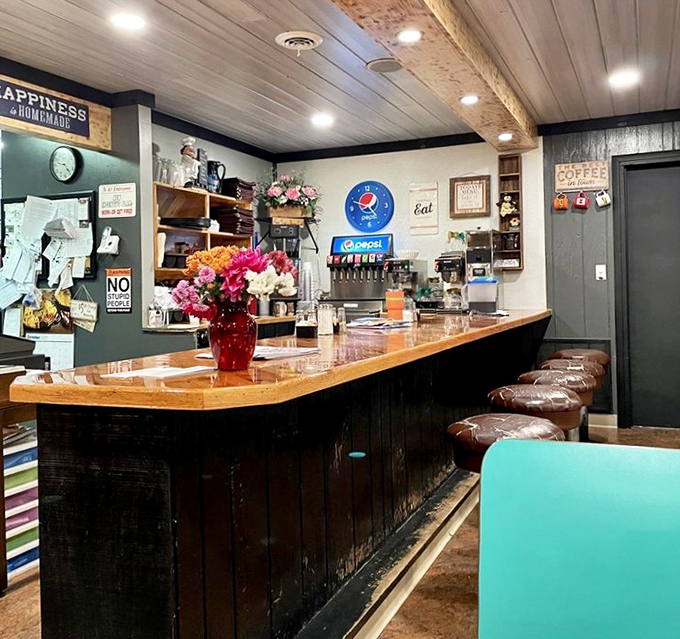 The service counter gleams with the promise of coffee refills and friendly banter. That wooden bar has heard more local news than any Facebook feed.