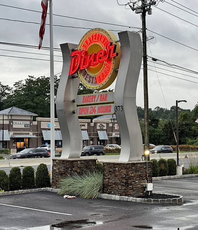 The neon sign doesn't just announce a diner &ndash; it's a beacon of hope for hungry travelers and a 24-hour promise of satisfaction.