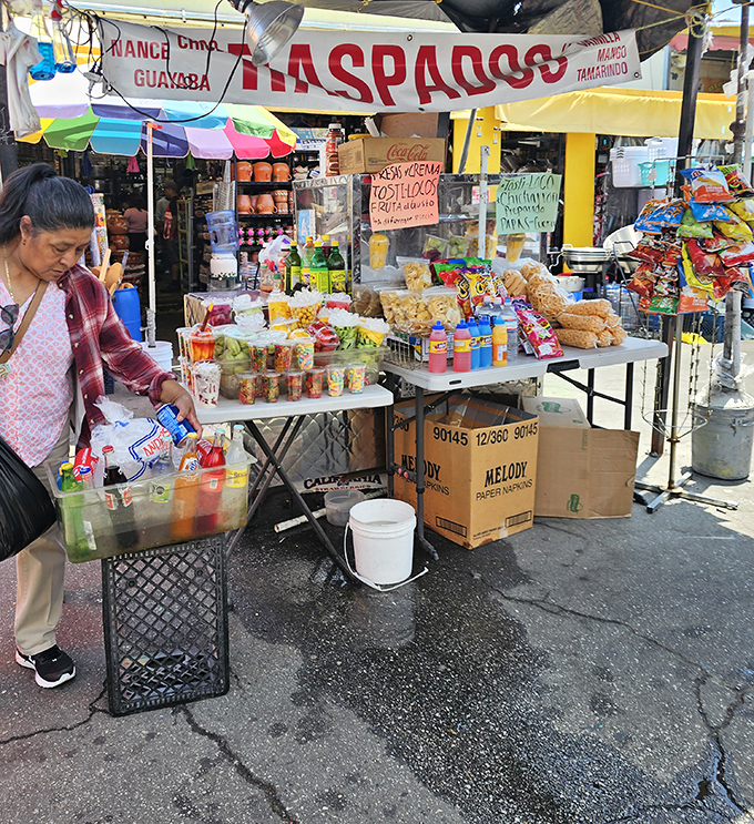 Snack central! From raspados to chicharrones, this stand offers a flavor fiesta that puts mall food courts to shame.