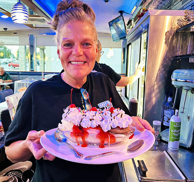 A dessert presentation that makes you forget all about calorie counting. That smile says everything about the joy of diner indulgence.