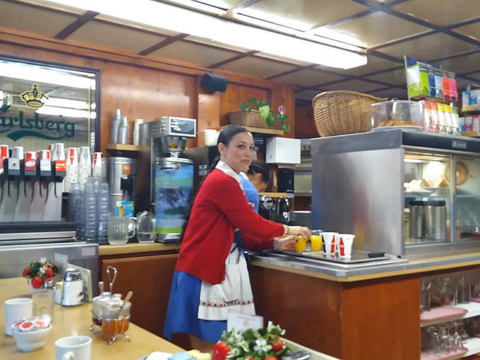 The traditional Danish serving uniforms aren't costume—they're another authentic touch in a place that respects its cultural heritage down to the smallest detail.