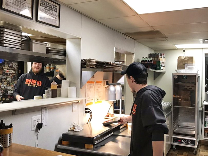 Behind the scenes, the magic happens with practiced hands and a dedication to craft that turns simple ingredients into BBQ gold.