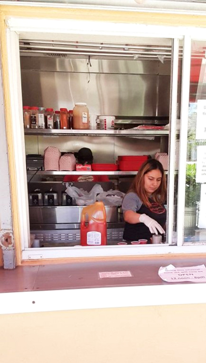 Behind every great hot dog stand is a dedicated team working their magic in a space smaller than most walk-in closets.