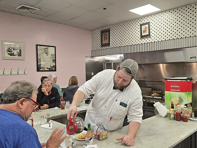 The server-customer relationship here is part food service, part stand-up comedy, and entirely the reason why people keep coming back for decades.