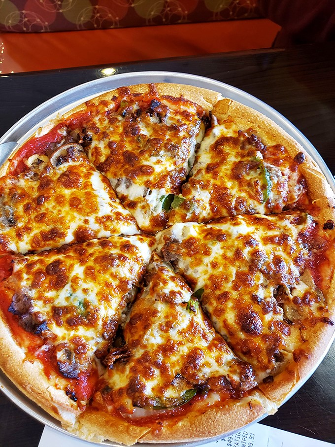 Pizza perfection isn't complicated—just the right cheese-to-sauce ratio on a crust that knows its supporting role in this delicious drama.