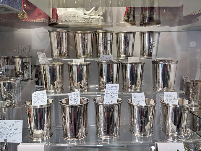 Silver mint julep cups that have seen more Kentucky Derbys than you ever will. Each one whispering tales of bourbon and big hats.