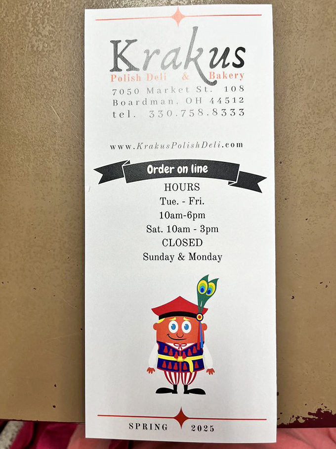 The business card reveals all you need to know: location, hours, and a cheerful cartoon mascot that says "we take our food seriously, but not ourselves."