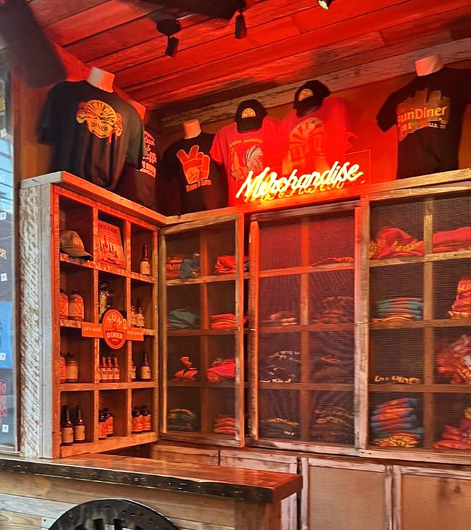 Merchandise display glowing under neon lights &ndash; take home a souvenir from your new favorite breakfast destination.