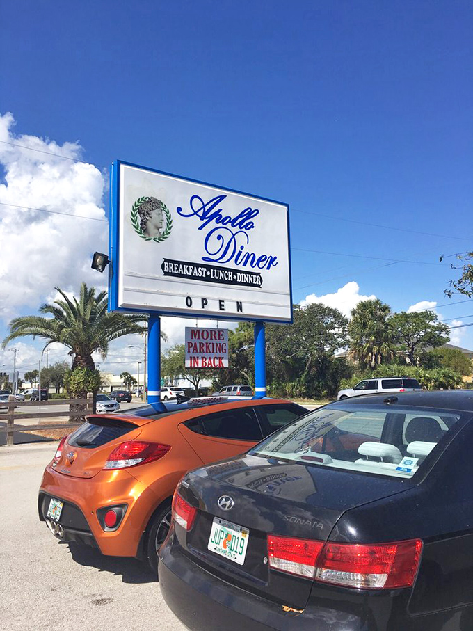 The Apollo Diner sign stands tall against Florida's blue sky, promising Greek-American comfort food that delivers on every syllable.