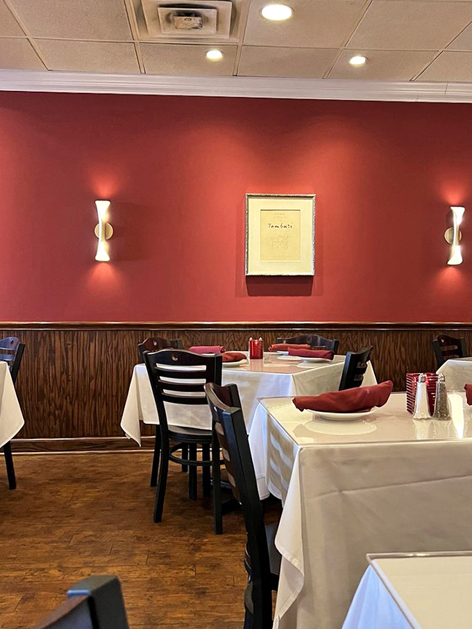Simple elegance meets comfortable dining, where burgundy napkins add just the right pop of color to every table setting.