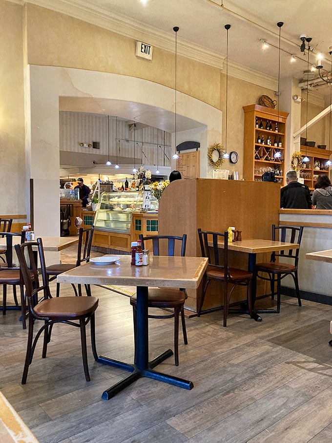 Tables arranged with just enough space for privacy but close enough to eavesdrop on what pastry your neighbor ordered that looks amazing.