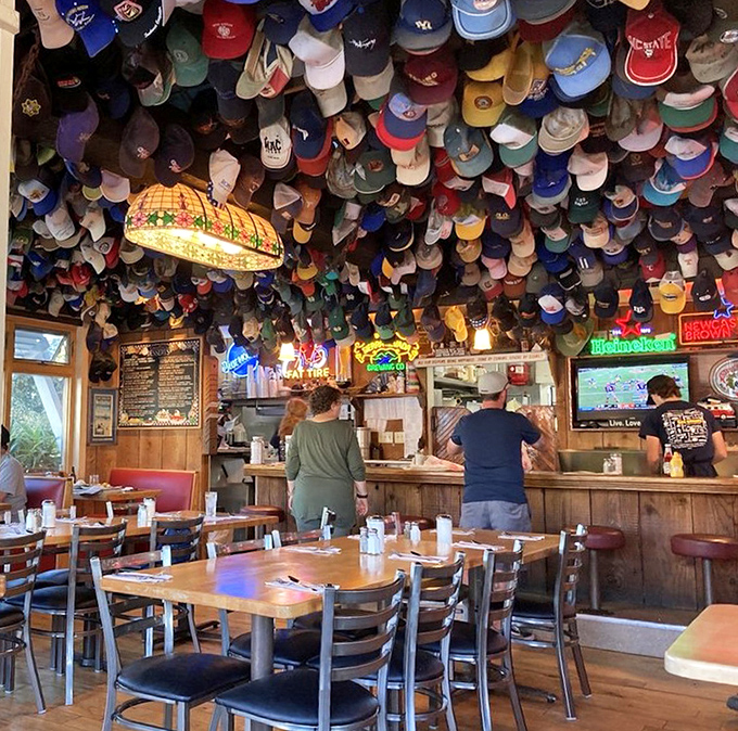 Where baseball caps go to retire and watch over diners. The wooden tables have hosted more memorable conversations than a therapist's office.