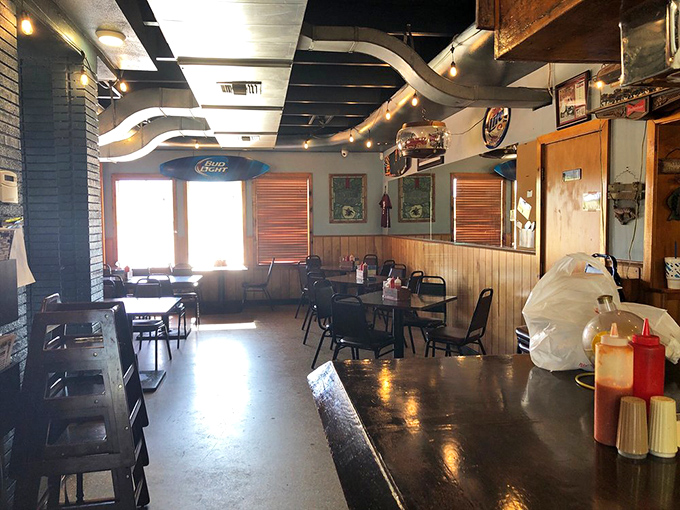 Sunlight streams through windows illuminating simple tables where countless "best meals ever" declarations have been uttered over decades.