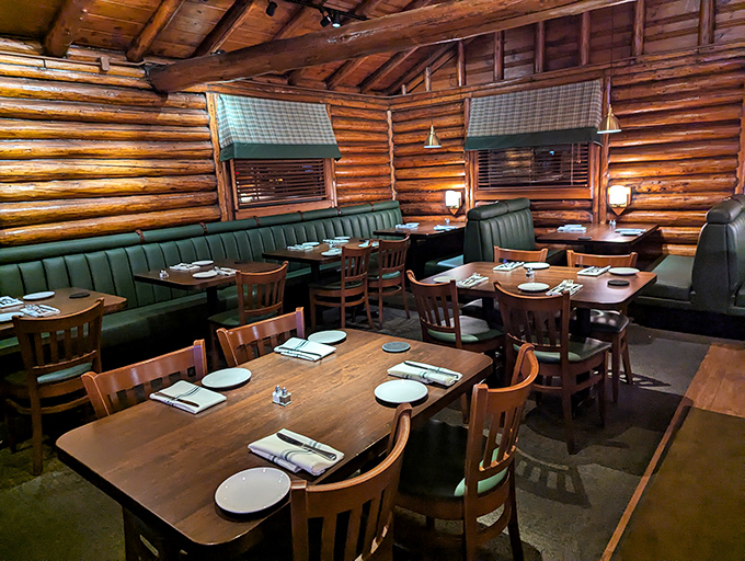 Green booths and wooden tables create intimate dining spaces that feel like you've scored the best cabin at summer camp&mdash;one with exceptional food service.